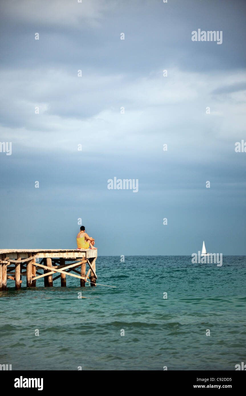 Sitting on end of pier hi-res stock photography and images - Alamy