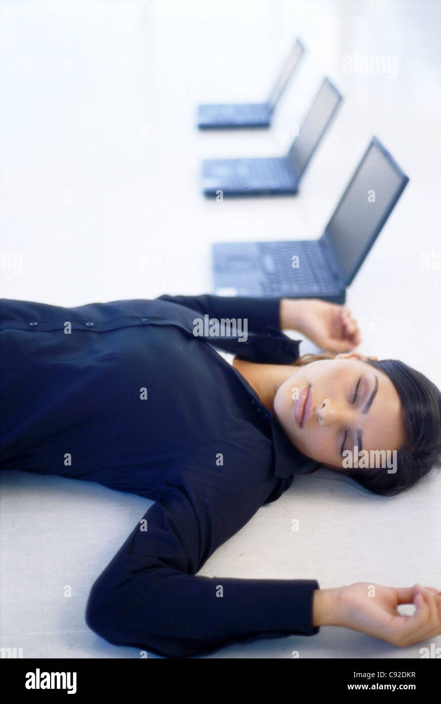 Businesswoman sleeping in office Stock Photo - Alamy