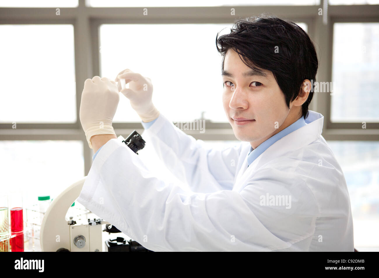 A young man experimenting in lab, close-up Stock Photo - Alamy