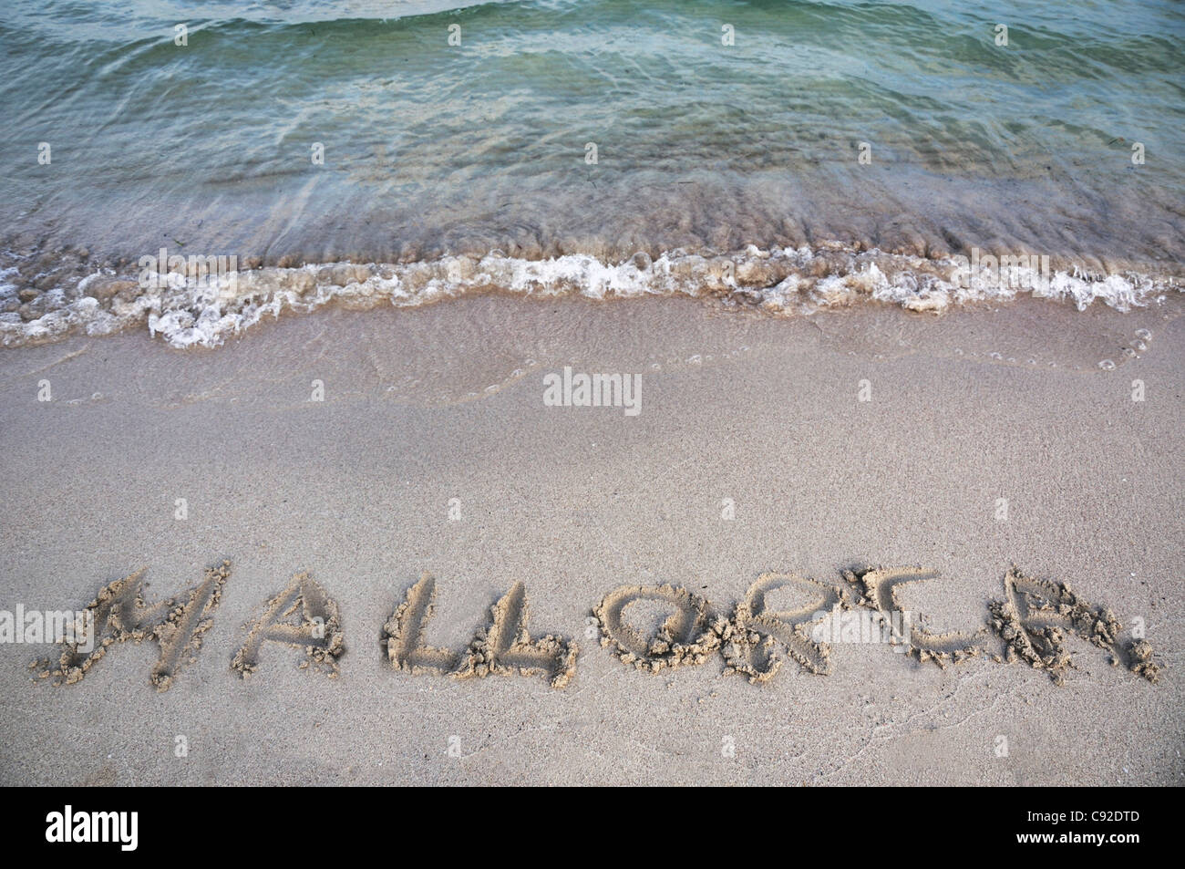 Mallorca written in the sand at the beach Stock Photo - Alamy