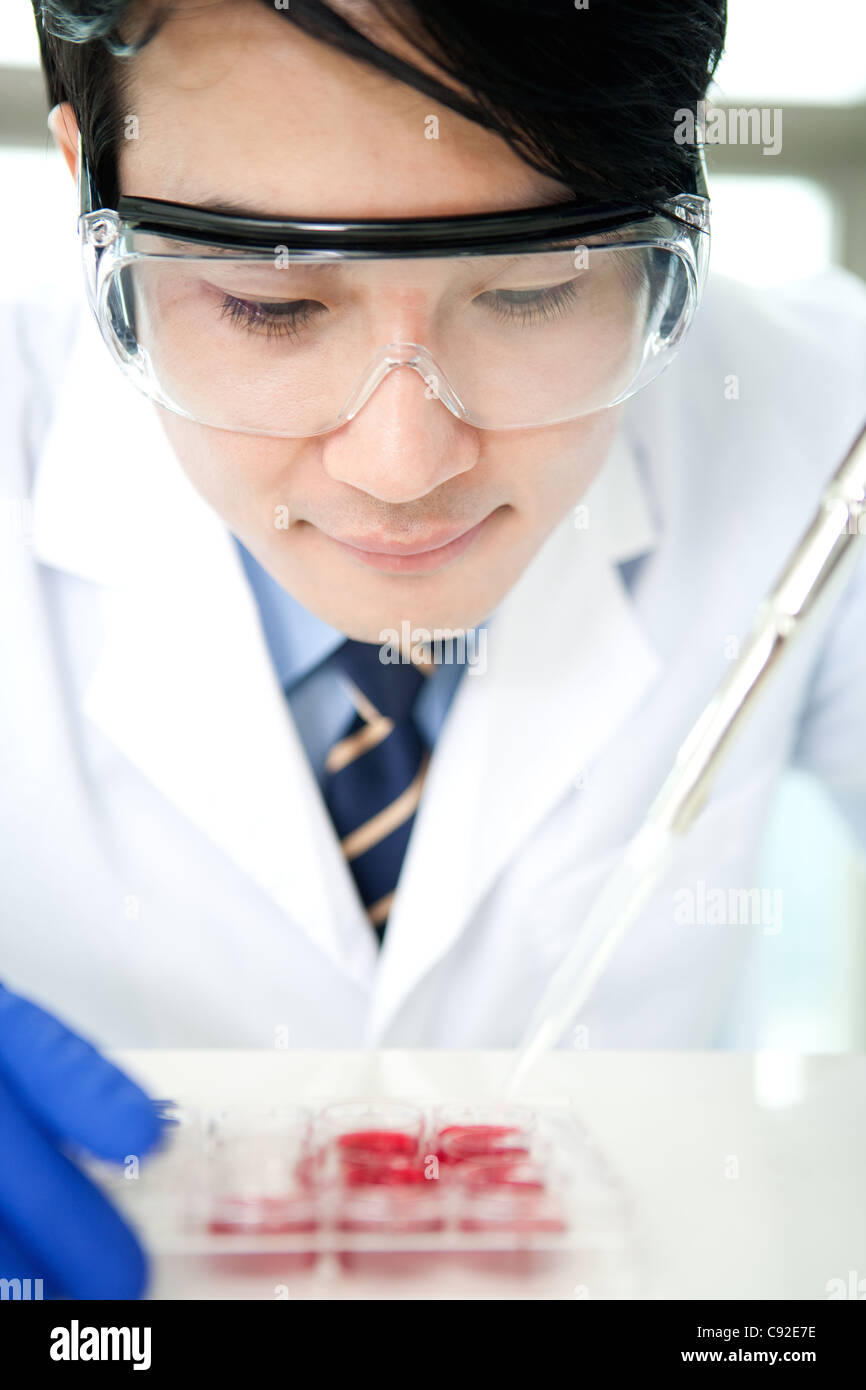 Man glasses pipette biochemistry hi-res stock photography and images ...