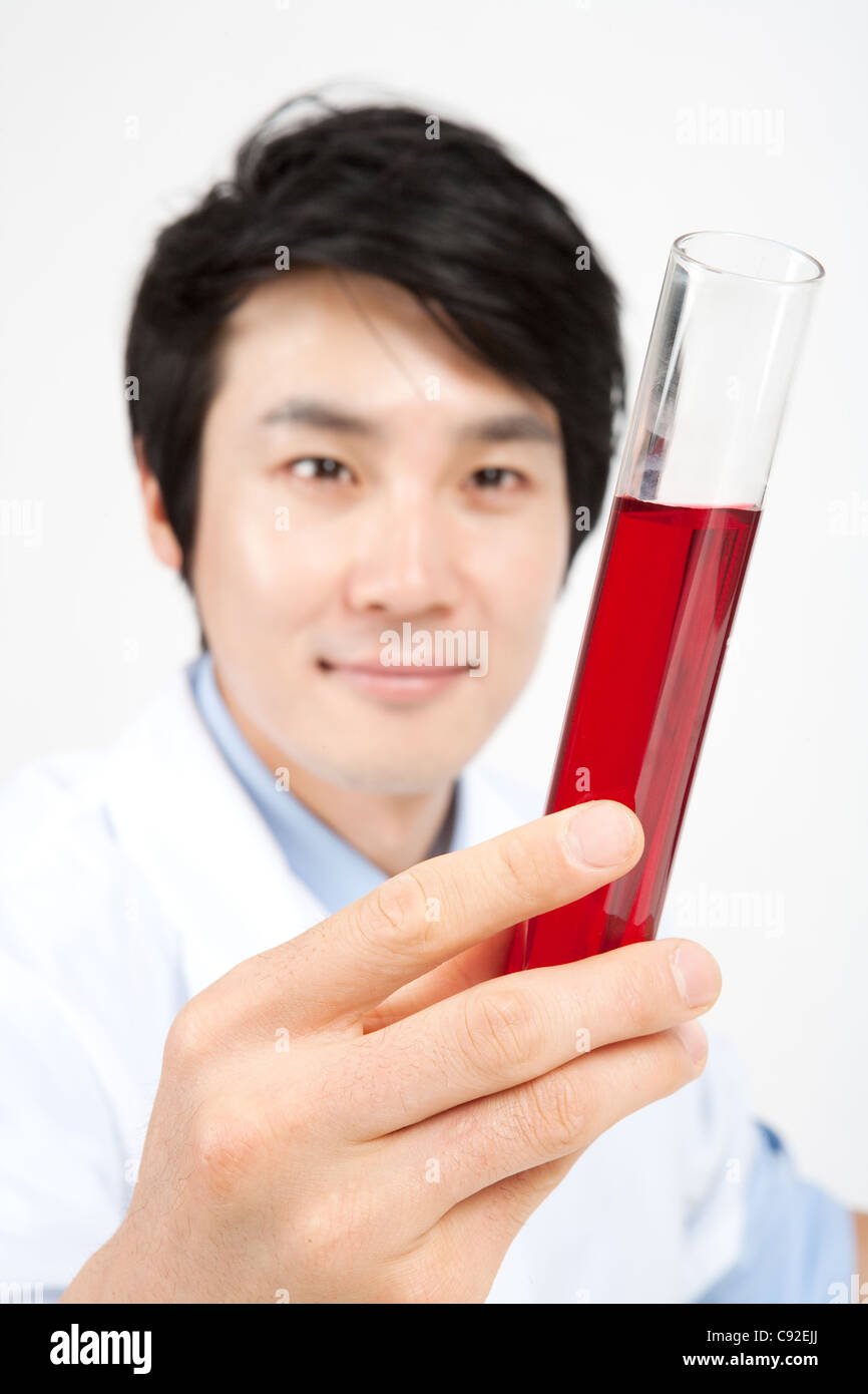 Scientist holding test tube, close-up Stock Photo - Alamy
