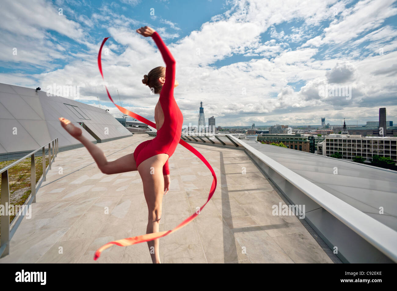 Dancer with ribbon on urban rooftop Stock Photo - Alamy