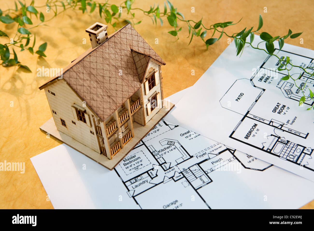 Model house on blueprints of home Stock Photo - Alamy