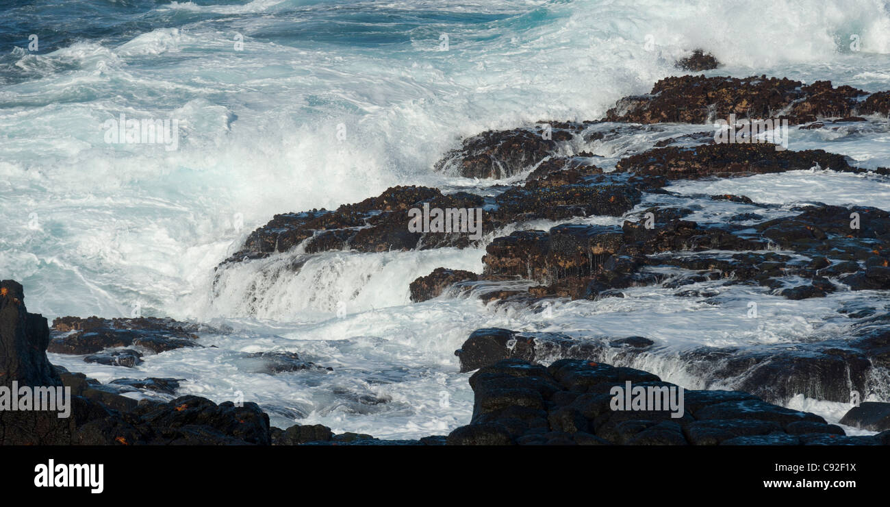 Waves crashing on rocky coast, Punta Suarez, Espanola Island, Galapagos ...