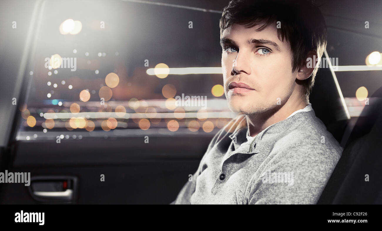 Man sitting in car at night Stock Photo - Alamy