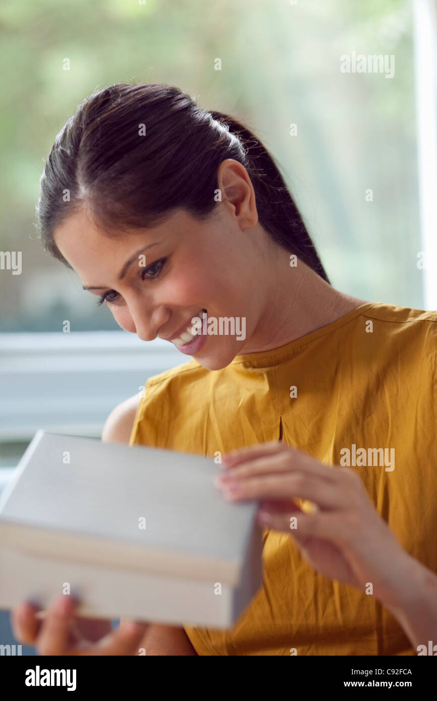 Woman opening box hi-res stock photography and images - Alamy