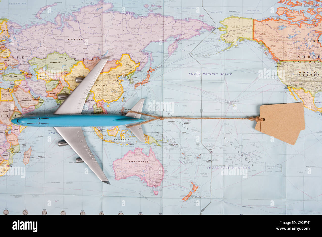 Airplane on map of the world Stock Photo - Alamy