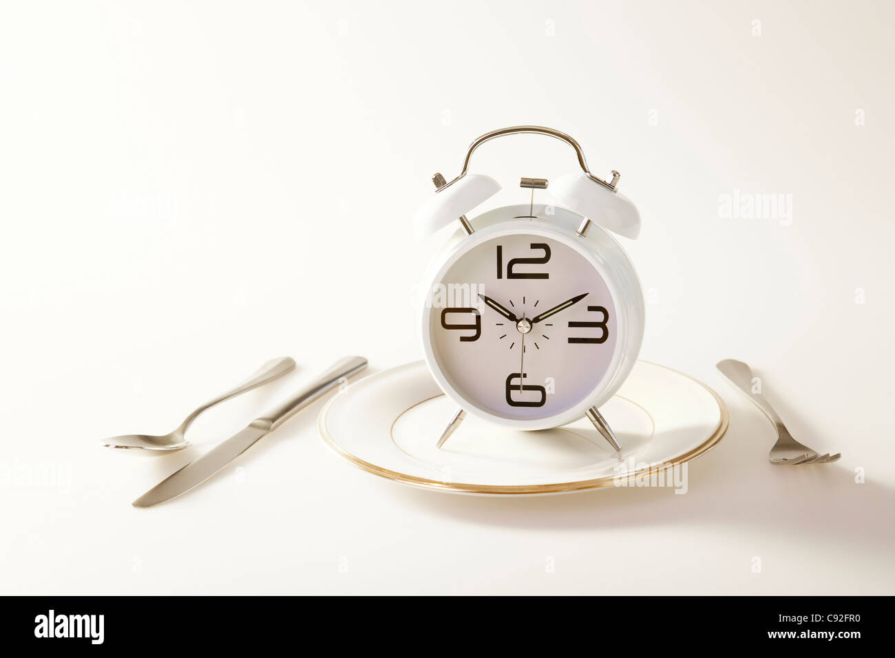 Alarm clock on plate Stock Photo - Alamy Alarm clock on plate Stock Photo - Alamy
