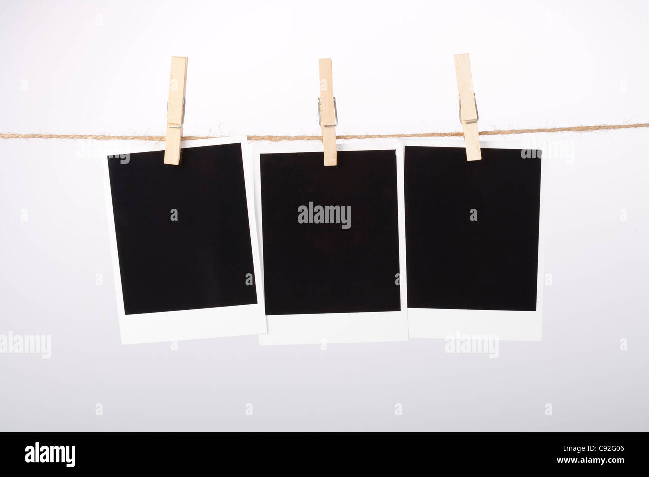 The Polaroid fastened to the string with the clip Stock Photo - Alamy