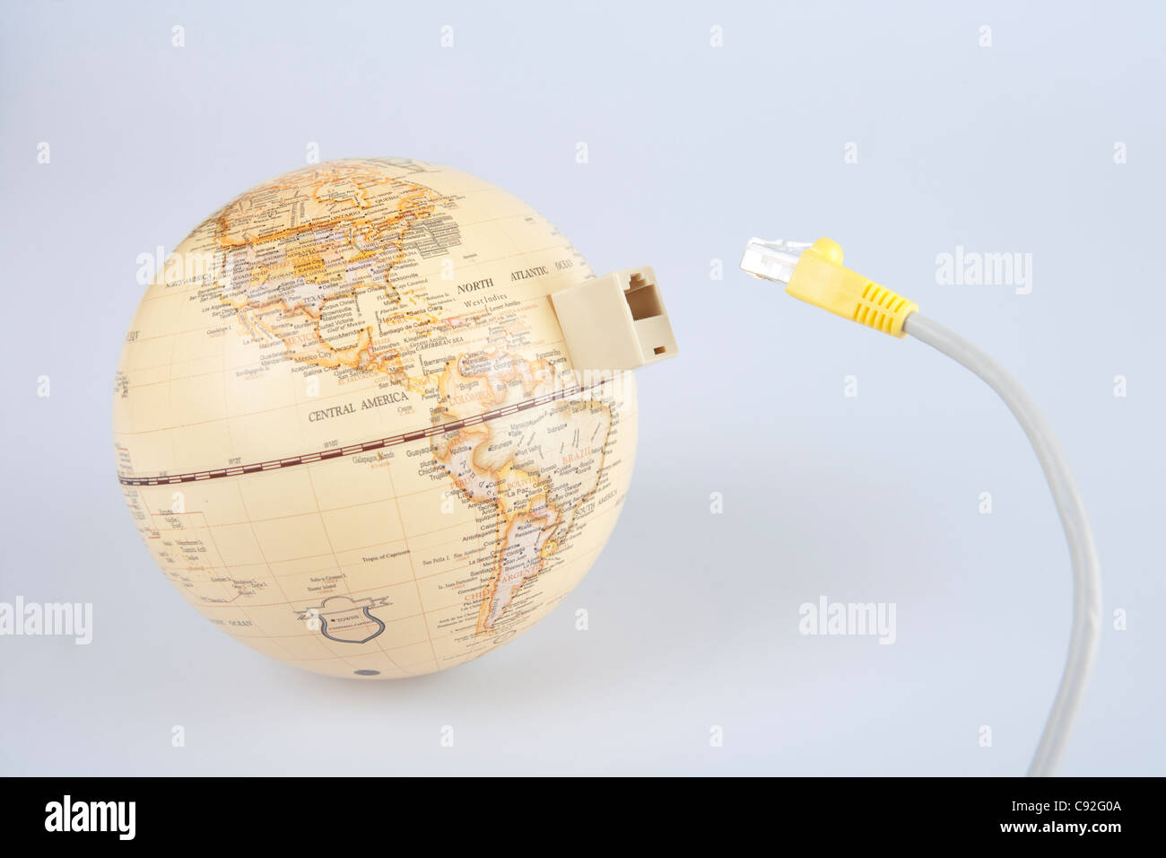 Globe with Ethernet port and cable Stock Photo - Alamy