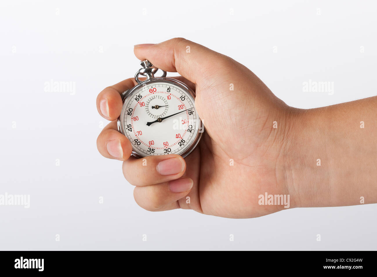 Hand holding stopwatch Stock Photo - Alamy
