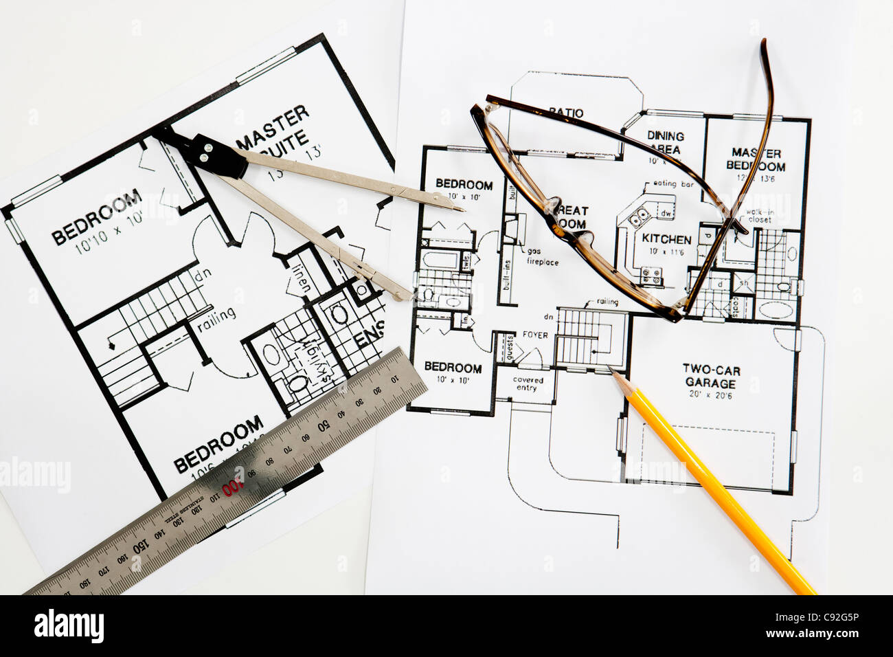 Surveying equipment on blueprints Stock Photo - Alamy
