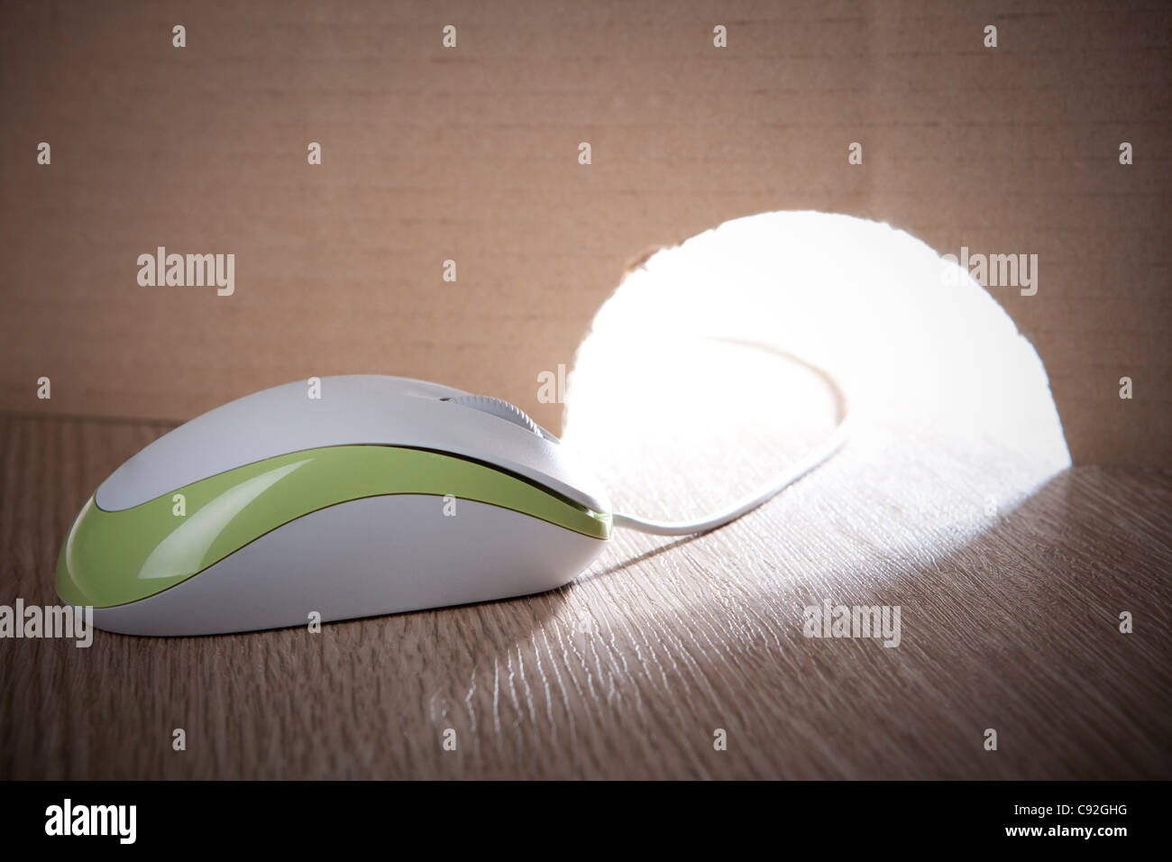 Computer mouse in mouse hole Stock Photo - Alamy