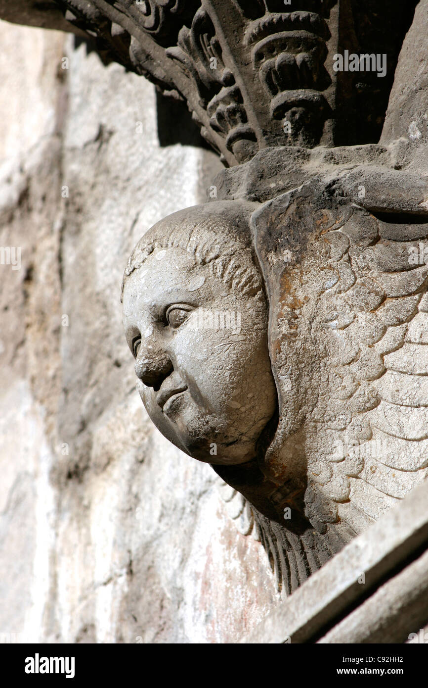 A carved stone angel on the wall of the 'Catedral' Cathedral of Girona ...