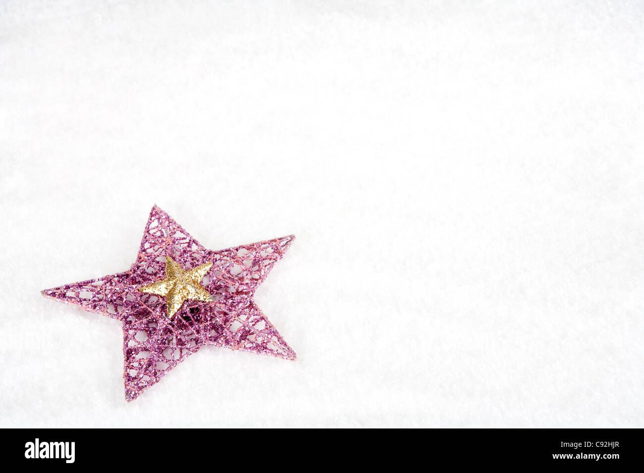 Star shape surrounded by snow Stock Photo - Alamy