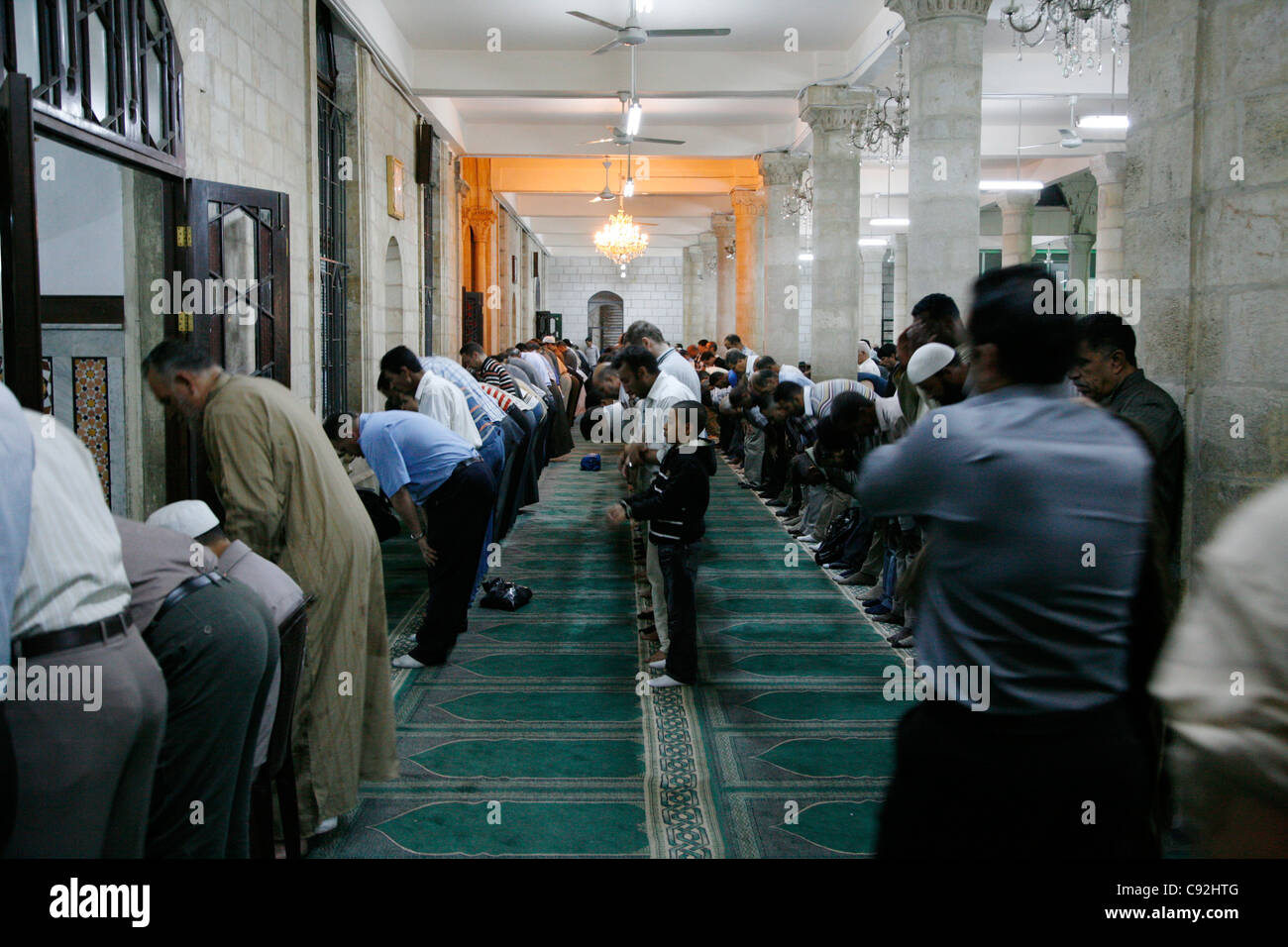 People praying at King Hussein (Al Husseiny) mosque in downtown Amman ...