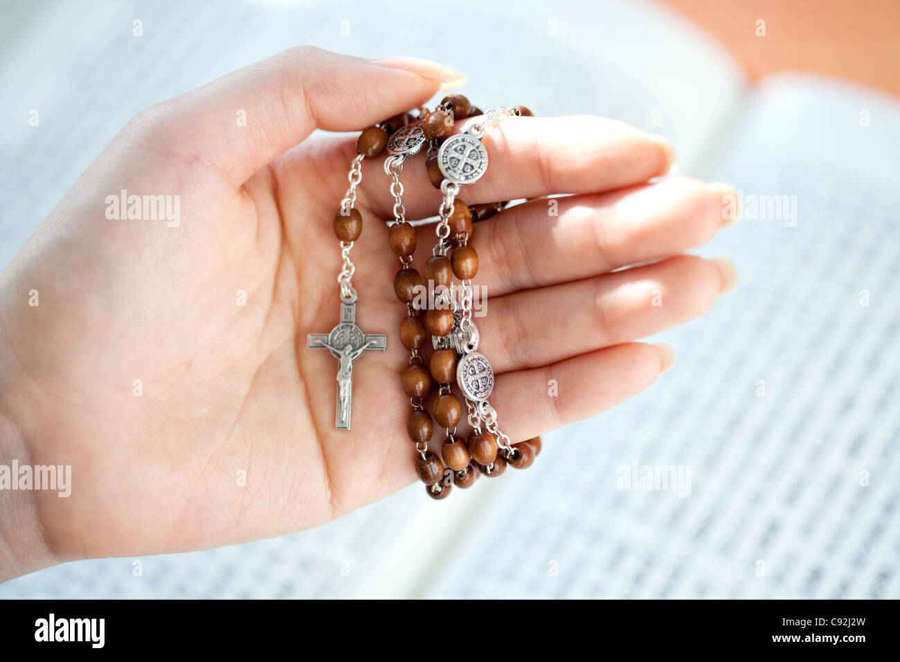 Human hand holding crucifix, part of Stock Photo - Alamy