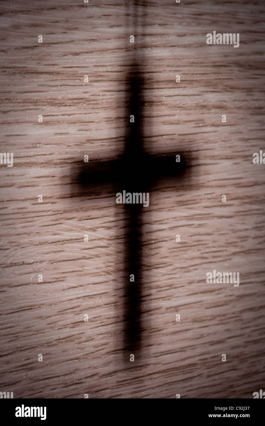 Shadow of crucifix on wall Stock Photo - Alamy