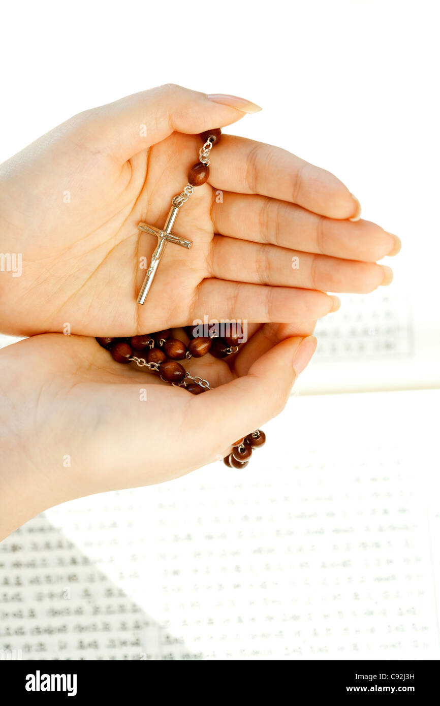 Human hand holding crucifix, part of Stock Photo - Alamy