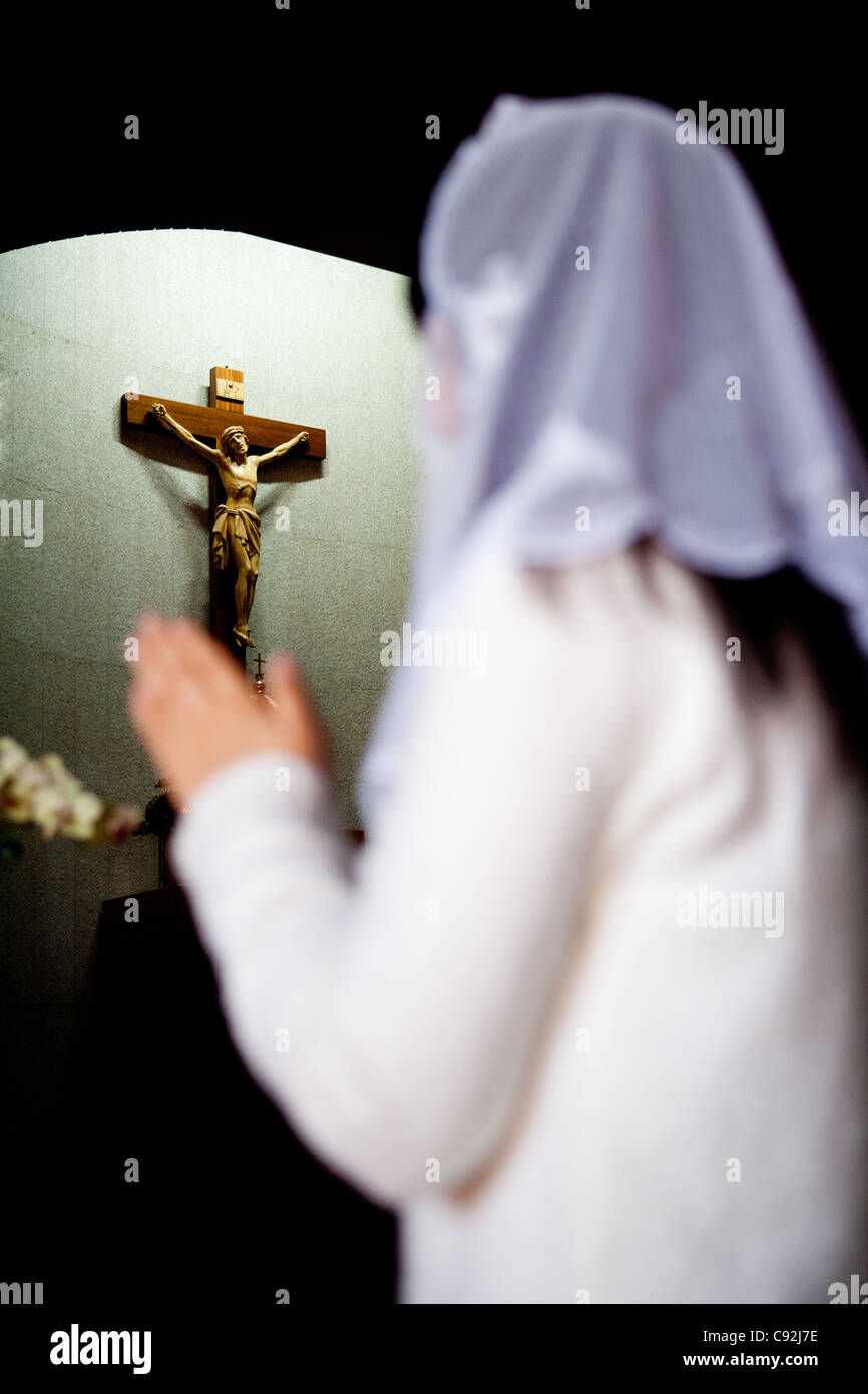 Woman church rear cross hi-res stock photography and images - Alamy