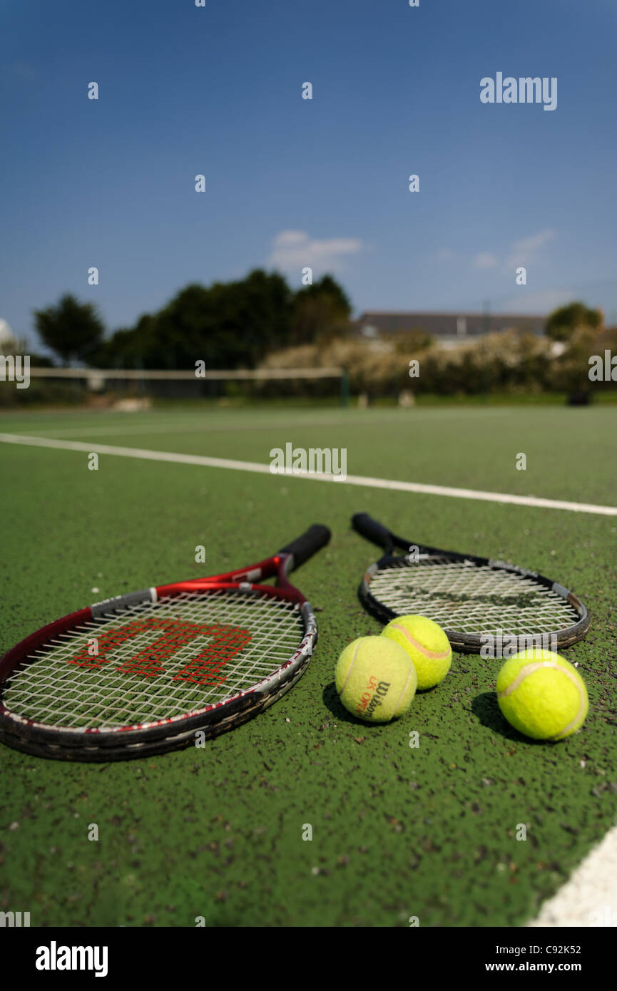 Tennis courts with rackets and balls, Cornwall Stock Photo - Alamy