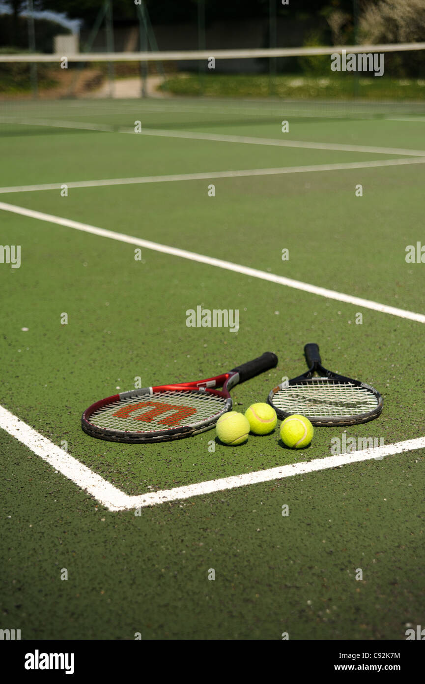 Tennis courts with rackets and balls, Cornwall Stock Photo - Alamy