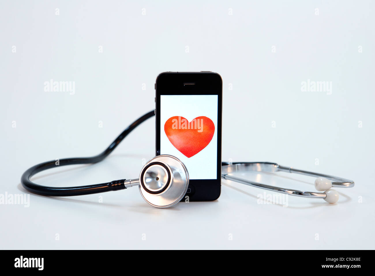 Smart phone with stethoscope Stock Photo - Alamy