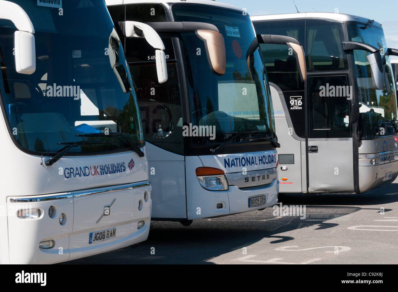 Tourist coaches lined up on a coach park at a tourist attraction Stock ...