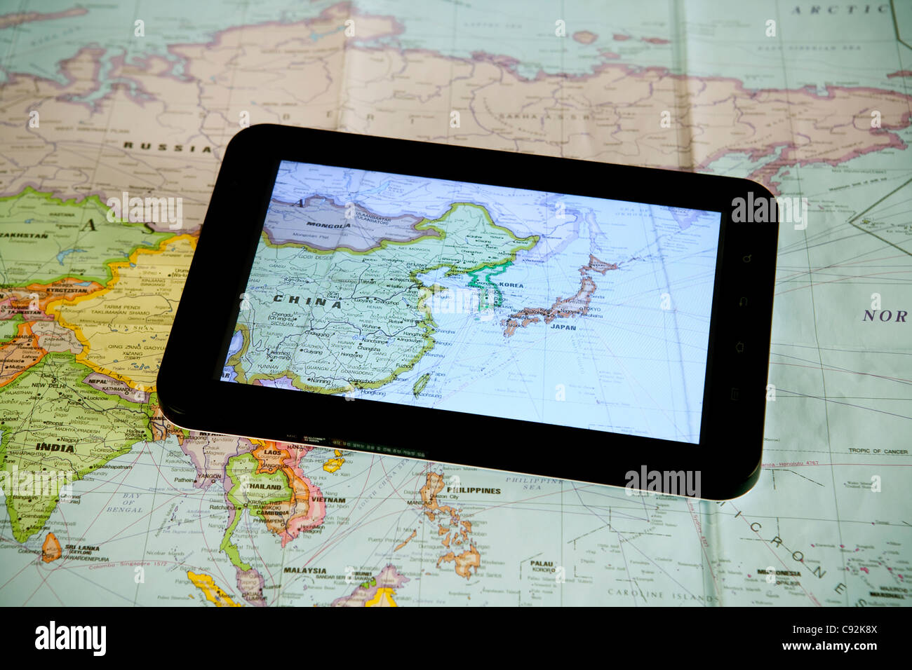 A map screen in tablet pc which is on map Stock Photo - Alamy