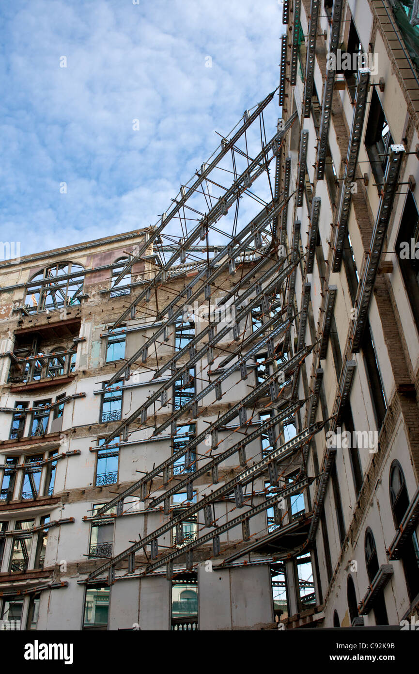 Scaffolding on a historic building facade. Props for the building in ...