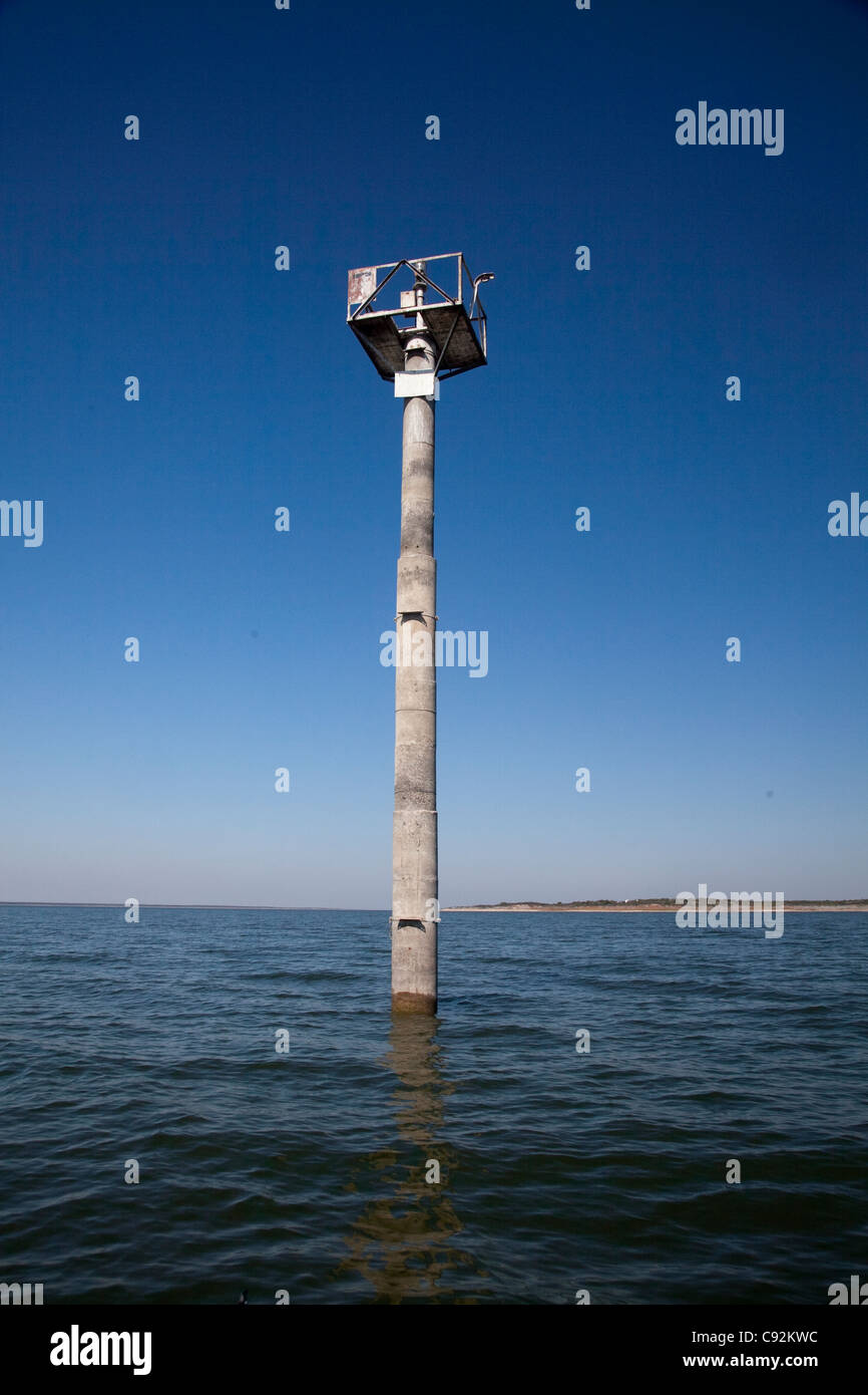 Concrete post marks the Rio Grande river channel and international ...