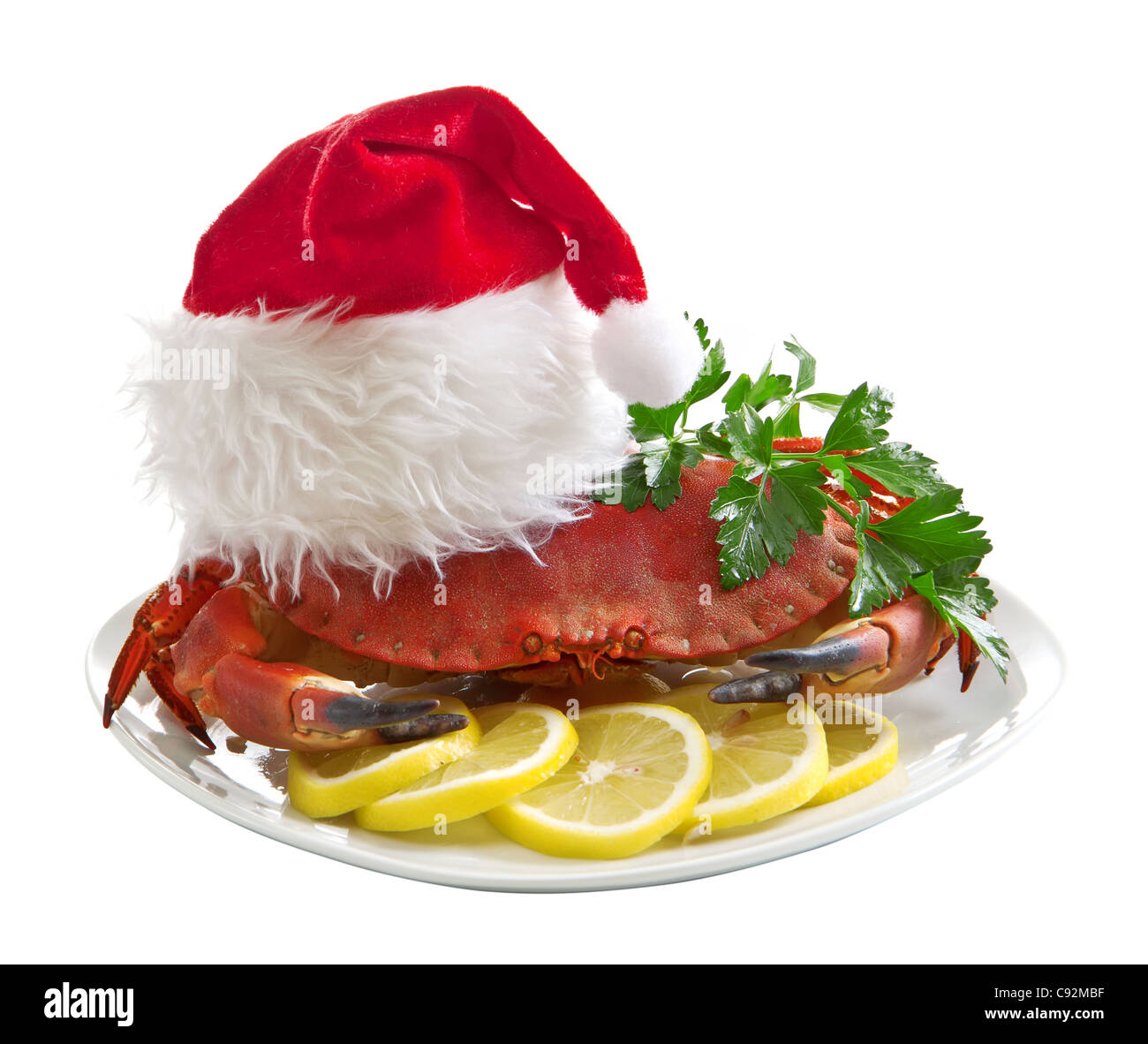 Crab in Santa Claus hat on a platter Stock Photo - Alamy
