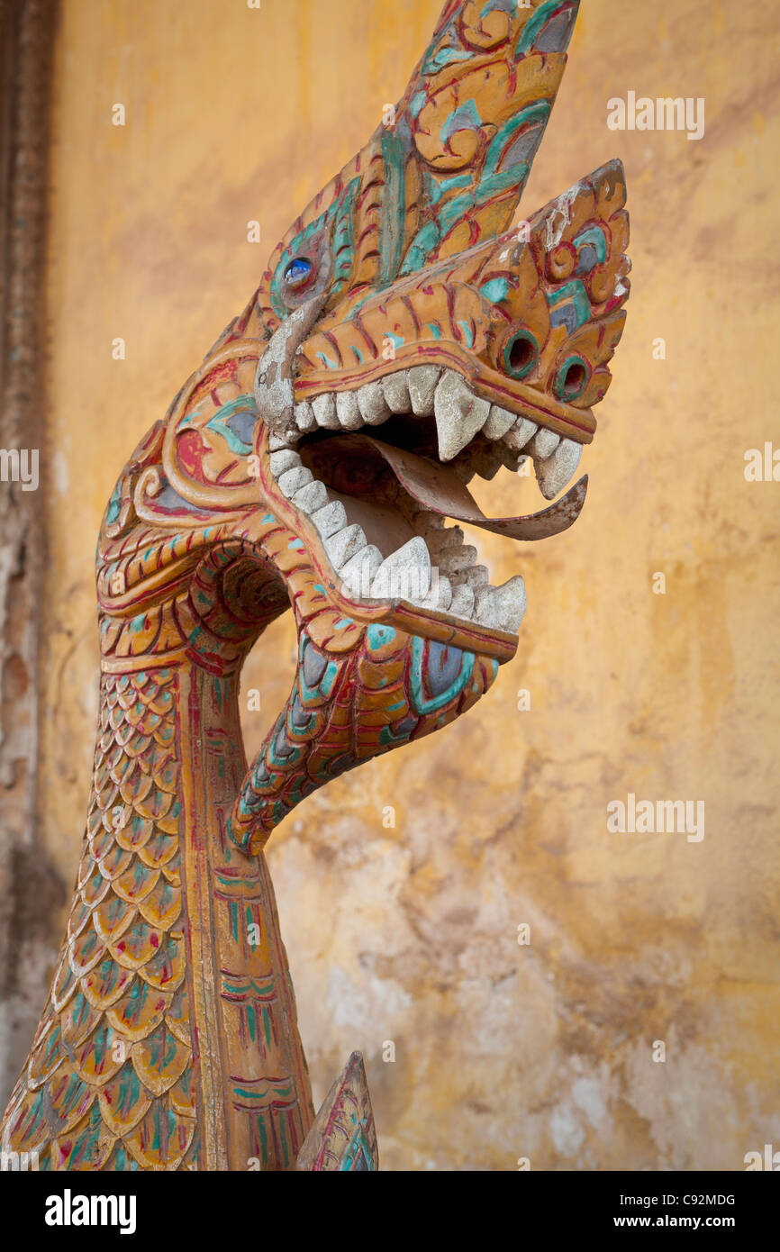 Naga (serpent deity) image on the 5 mt long wooden trough at Wat Si ...