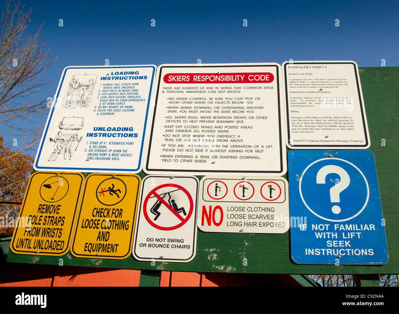 Safety warning signs at a ski lift Stock Photo - Alamy