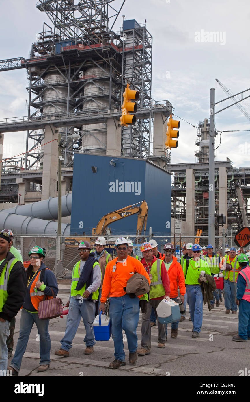 Construction Workers Shift Change at Oil Refinery. They are expanding ...