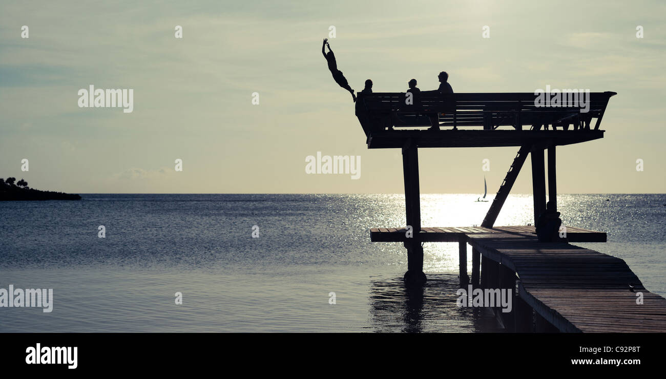 People jumping from pontoon. West End, Roatan, Honduras Stock Photo - Alamy