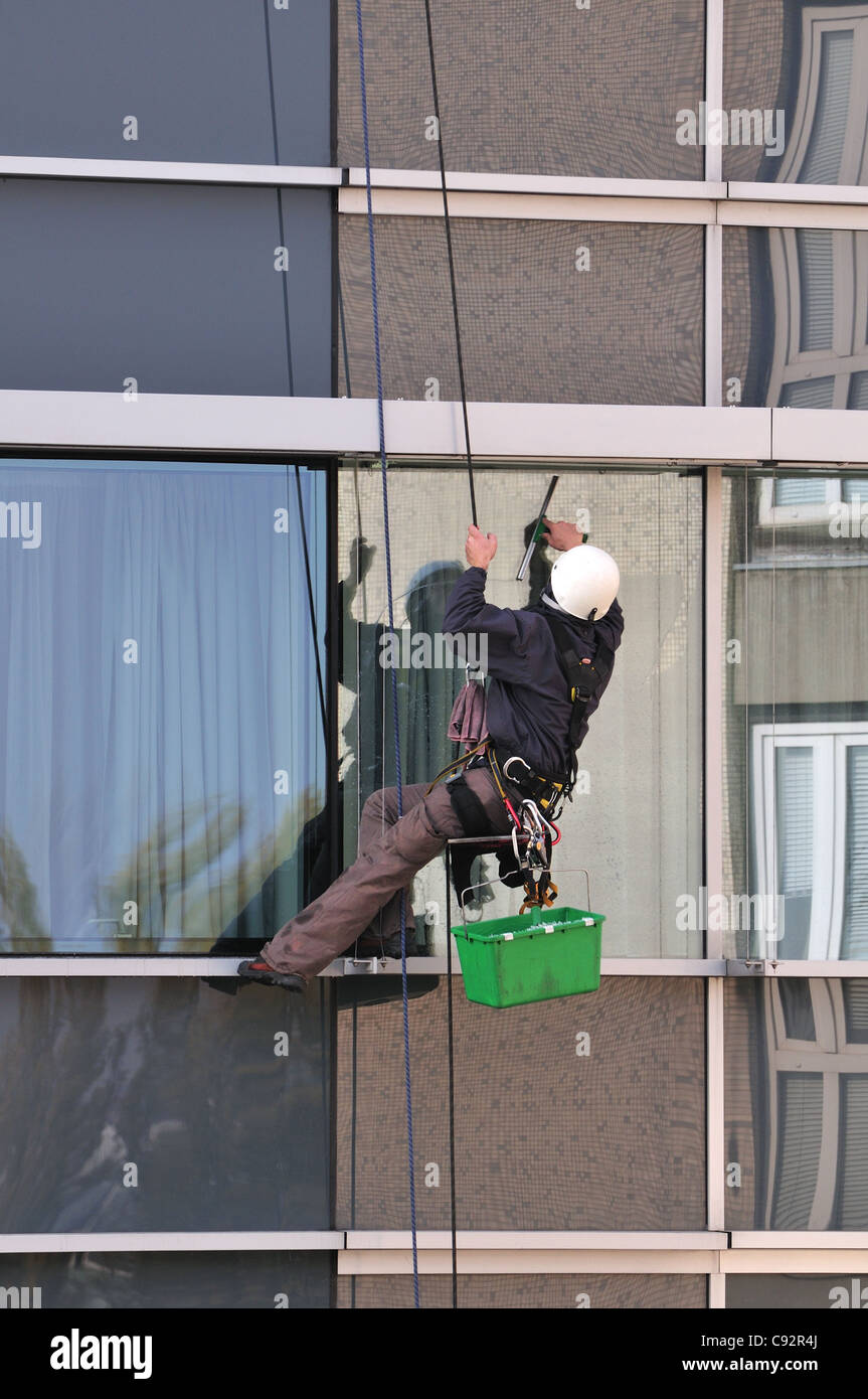 Window cleaner, working on the outside of an office building Stock ...