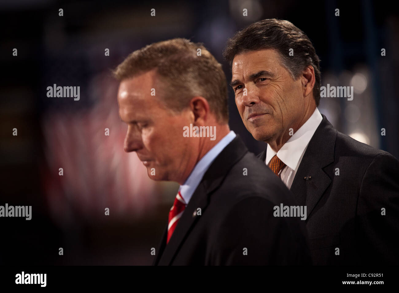 Republican presidential candidate Gov. Rick Perry watches the Jon ...