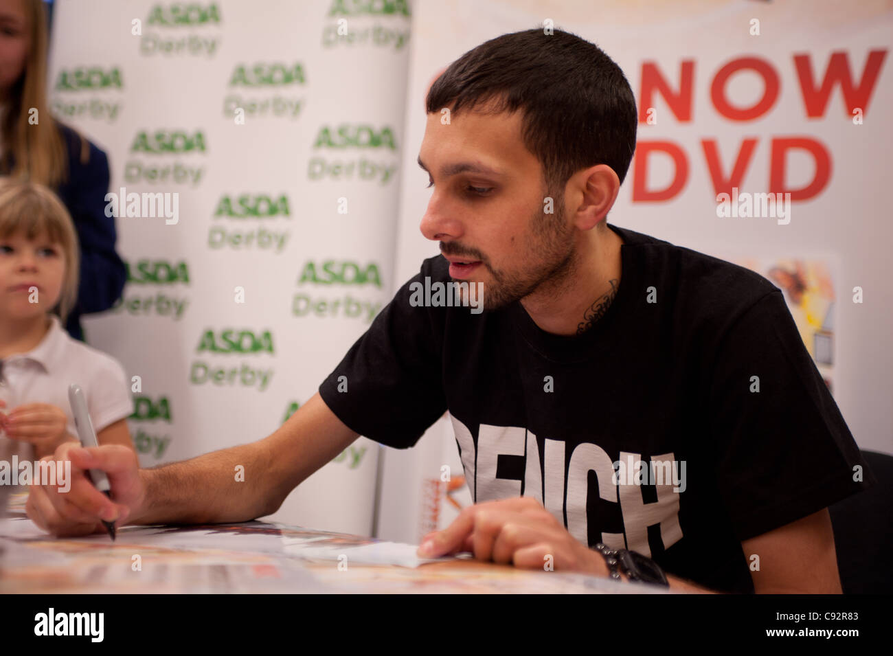 Dynamo meets waiting fans at Asda, Spondon, UK on the release of his ...