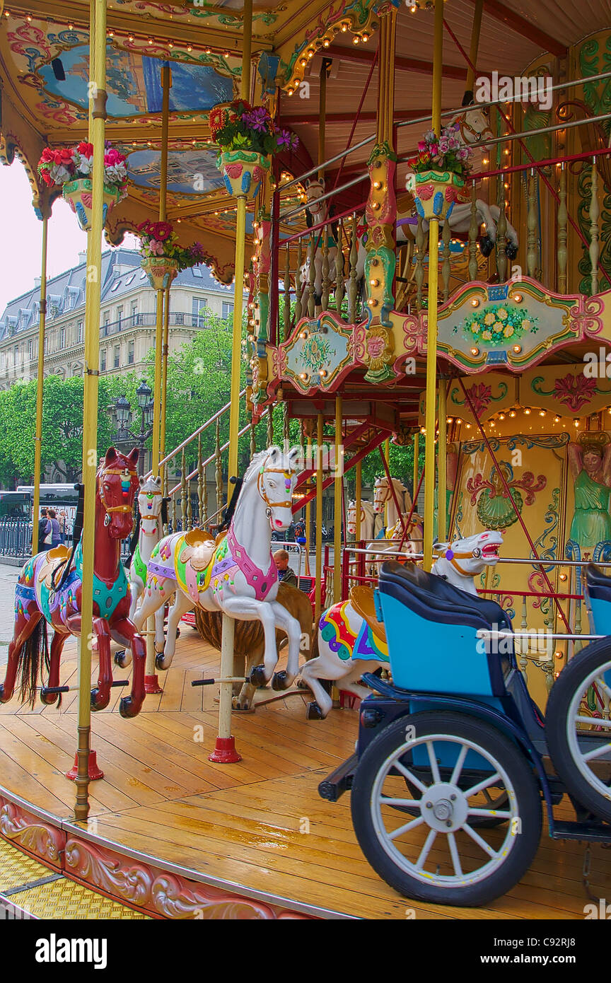 Carousel with beautiful wooden horses in Paris Stock Photo - Alamy