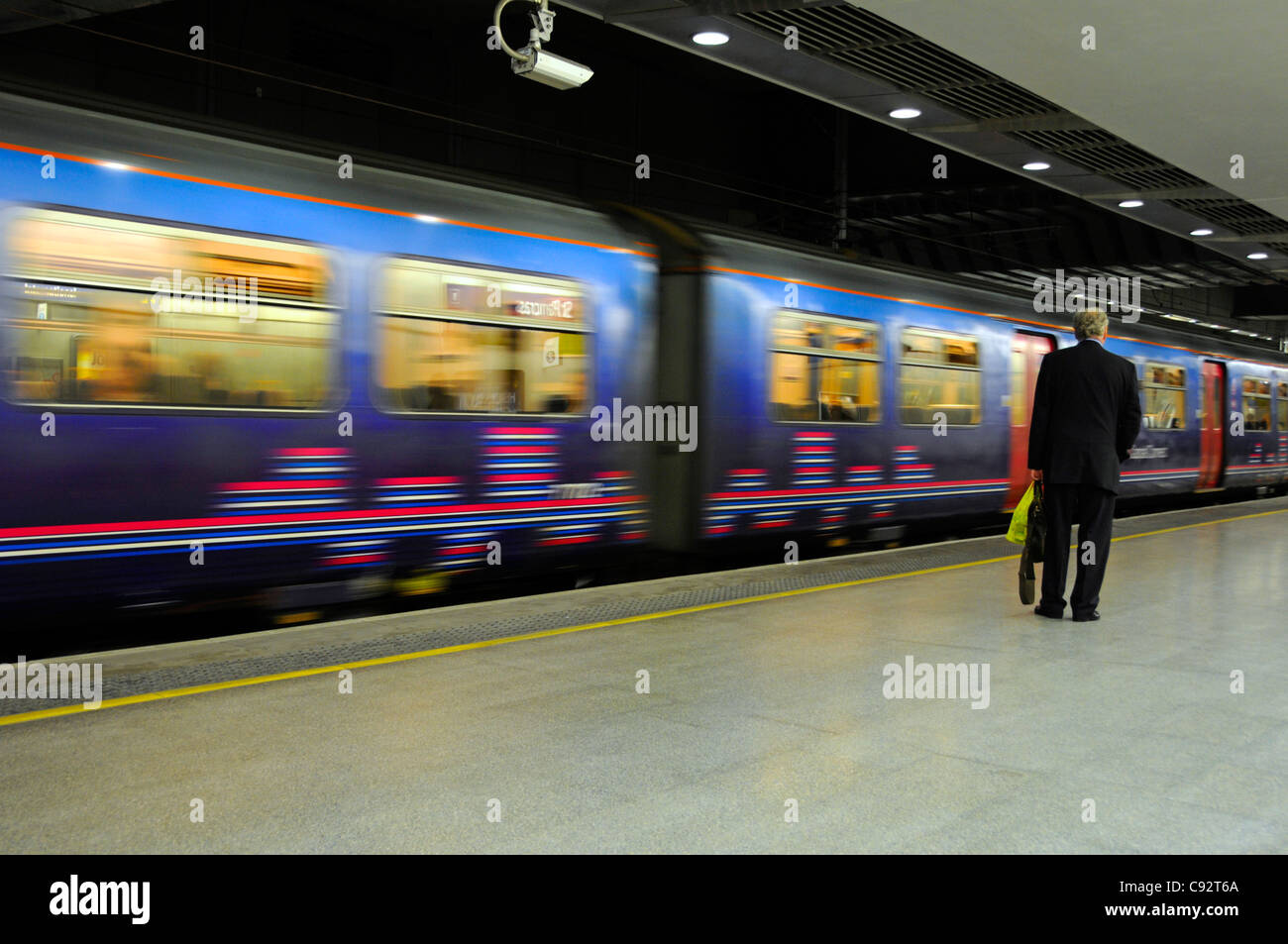 Motion blur of First Capital Connect train & platform at St Pancras ...