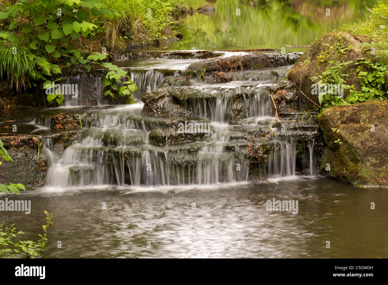 Waterfall at the 'burn' running through the estate of Cragside House ...
