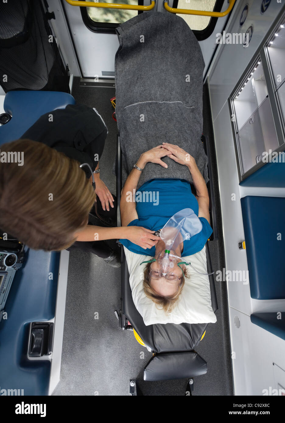 Above view of senior woman in ambulance with EMT worker Stock Photo - Alamy