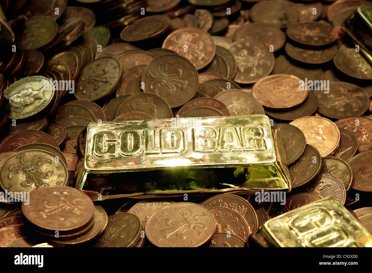 British coins and imitation gold bullion bar UK Stock Photo - Alamy
