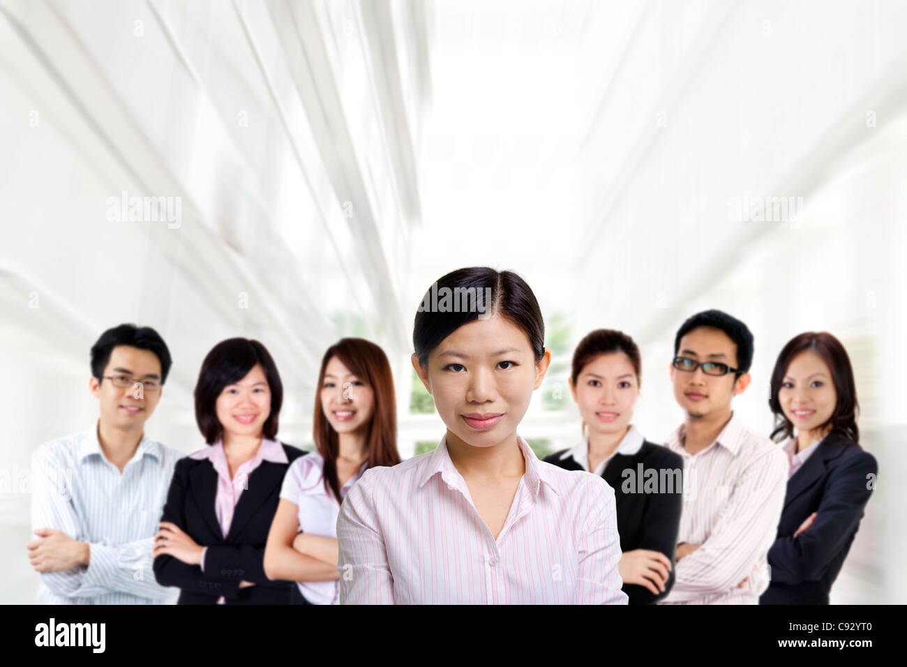 Asian business team on office background Stock Photo - Alamy