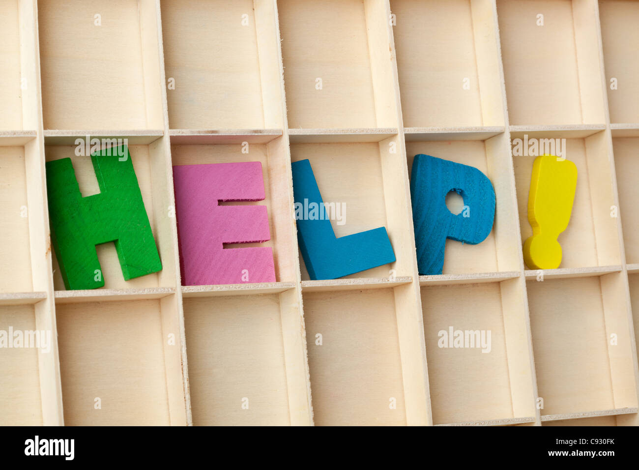 Wooden letter blocks forming the word HELP! Stock Photo - Alamy