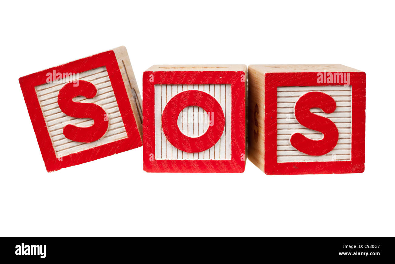 Wooden blocks forming the letters SOS isolated on white background ...