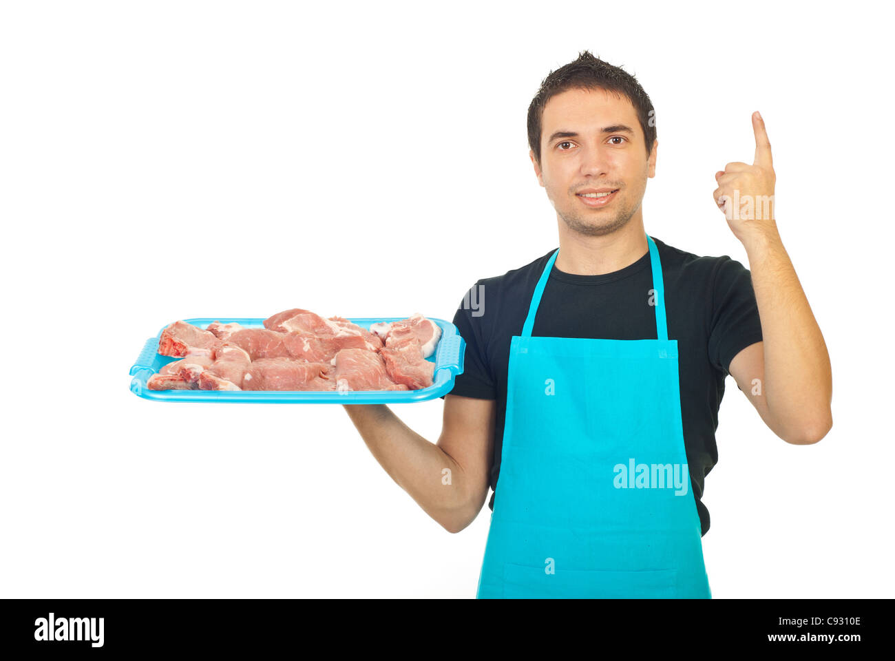 Butcher holding raw meat and pointing up to copy space isolated on ...