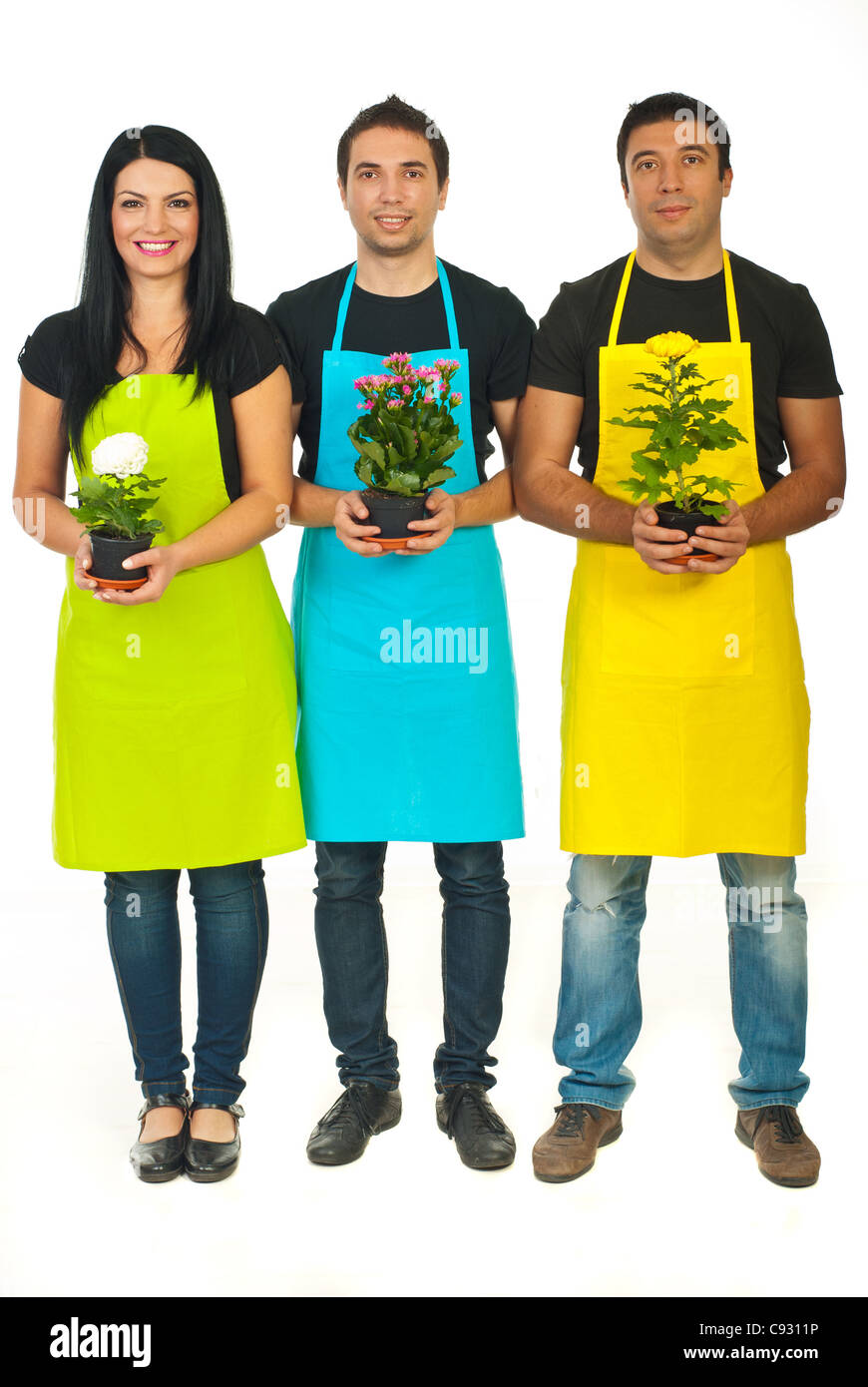 Full length of three florists team holding flowers in pots isolated on ...